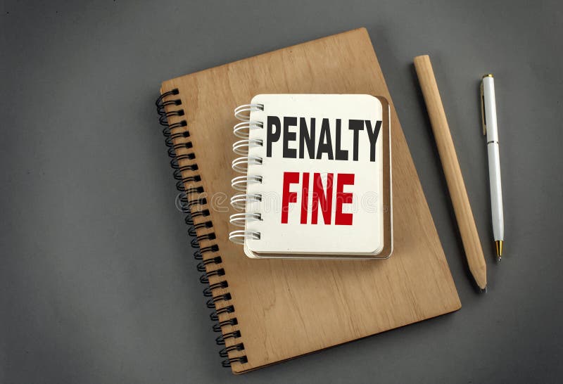 PENALTY FINE Text on Notebook with Pen and Pencil on Grey Background ...