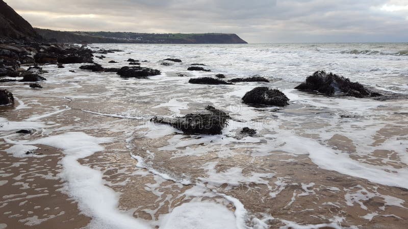 Penbryn Beach stock photo. Image of cloud, cove, terrain - 84997132