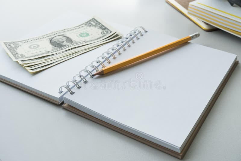Pencil and Bills Money on Notebook.financial Saving Stock Image - Image ...