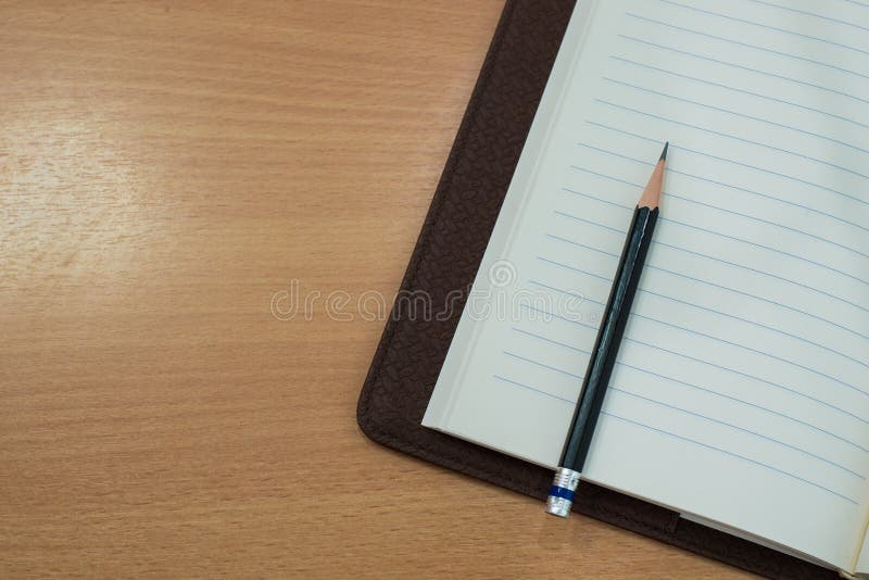Pencil and Notebook on Wooden Table. Top View Stock Image - Image of ...