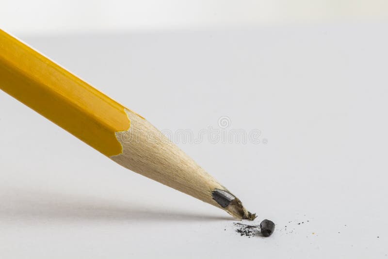 Sharpened Pencil With A Broken Tip Over A Blank Sheet Of Paper Stock ...
