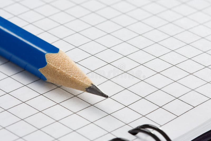 Pencil on checked notebook stock image. Image of checked - 31454835