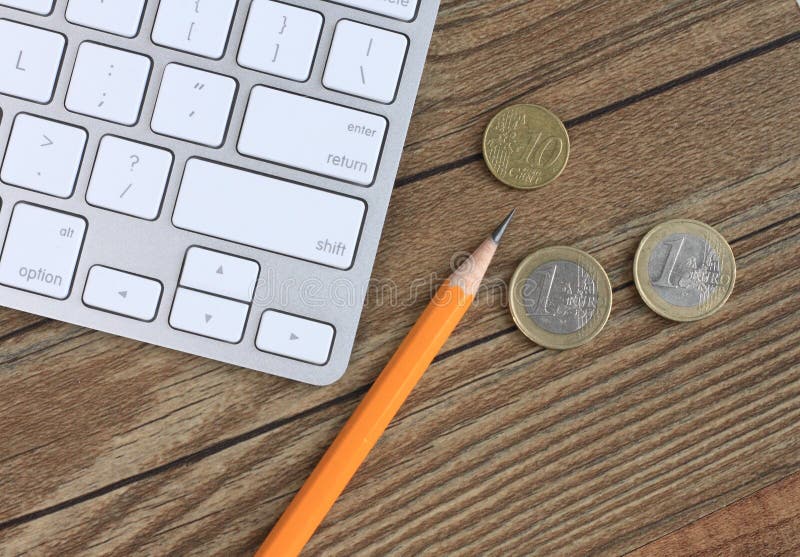 Pencil, coins and keyboard stock image. Image of budget - 42441439
