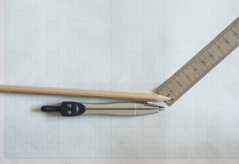 Pencil, Compass and Rulers on Graph Paper Background Stock Photo ...