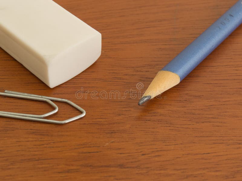 Pencil, Eraser and Clip on Wooden Table Stock Image - Image of ...