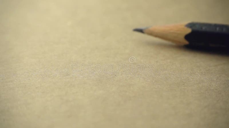 Pencil Falling into Brown Notebook in Slow Motion Stock Footage - Video ...