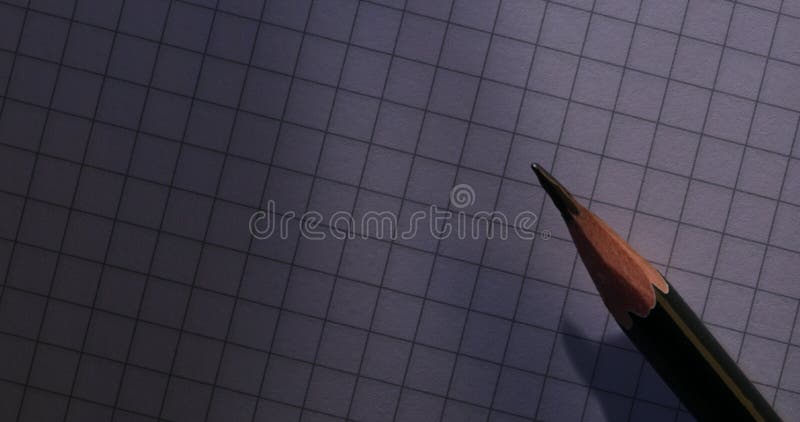 Pencil on Grid Notebook Paper with Light and Shadow Stock Image - Image ...