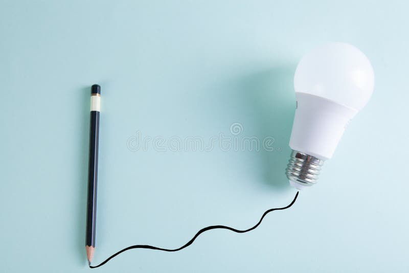 Pencil and Light Bulb on the Table Stock Photo - Image of lead, table ...