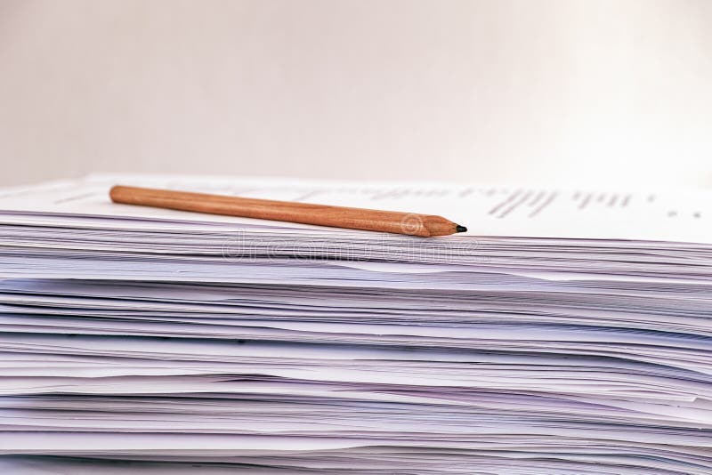 A Pencil Lying on a Stack of Paper Sheets Stock Photo - Image of lying ...