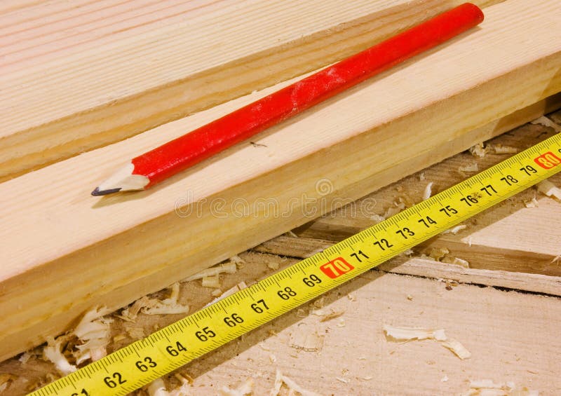 Construction Tape Measure on Carpentry Wood Board Stock Photo - Image ...