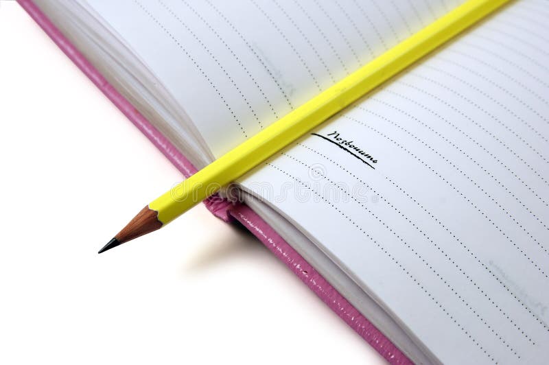 Pink notebook and pencil stock photo. Image of object - 6517750