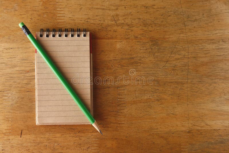 Pencil and a Notebook on a Table Stock Photo - Image of notebook, table ...
