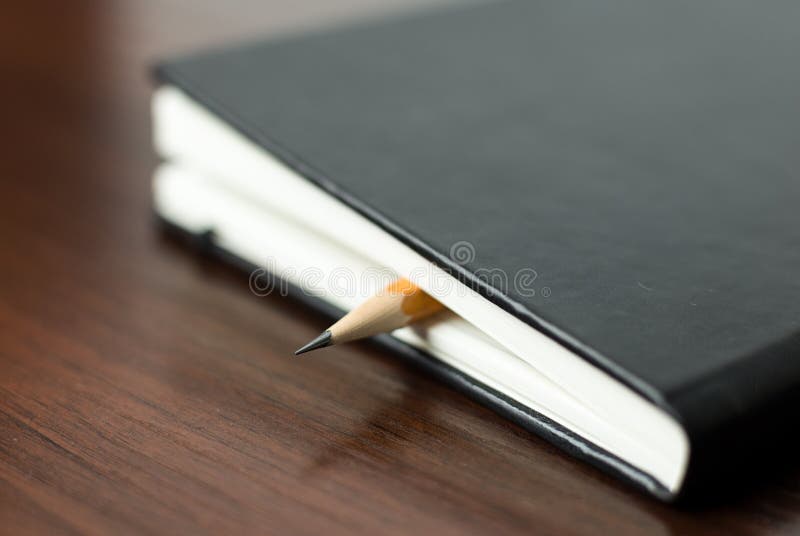 Closed Notebook and Pencil on Over White Stock Image - Image of jotter ...