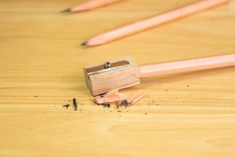 Pencil and Pencil Sharpener on Wood Table Stock Photo - Image of ...