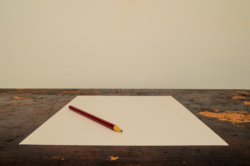 A Pencil is on a Piece of Paper on a Table Stock Photo - Image of book ...