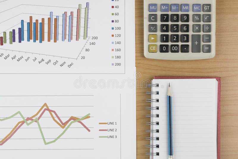 Pencil Placed on Notebook with Calculator and Graph on Wood Tab Stock ...