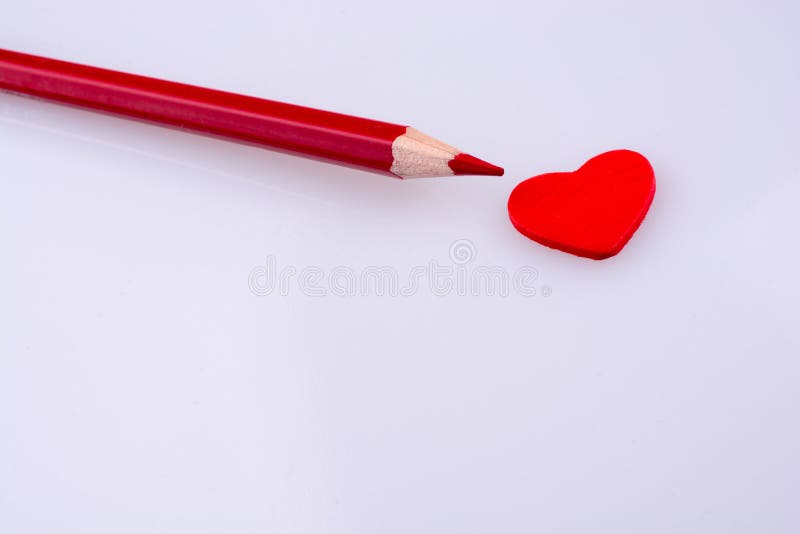 Pencil pointing a heart stock photo. Image of learn - 145712096