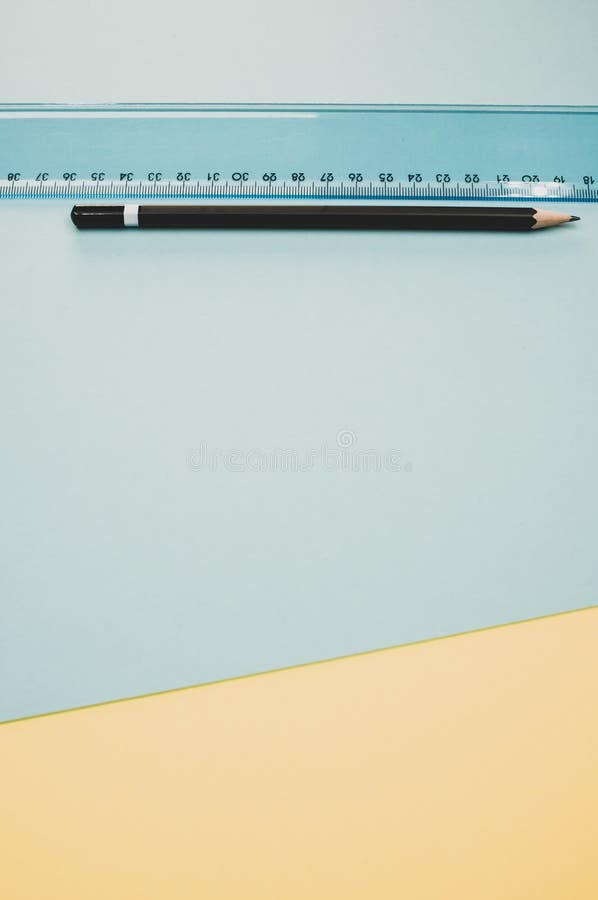 Pencil and a Ruler on a Blue Paper Stock Photo - Image of blue, pencil ...