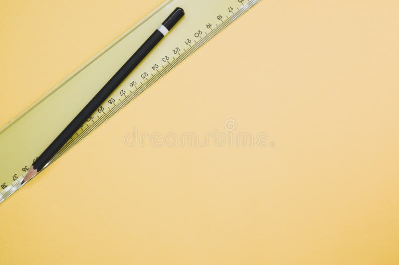 Pencil and a Ruler on a Yellow Paper Stock Photo - Image of ruler, note ...