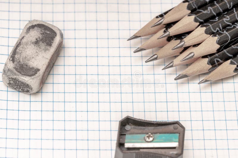 Pencil Sharpener and Pencils on Squared Paper. Top View with Space for ...