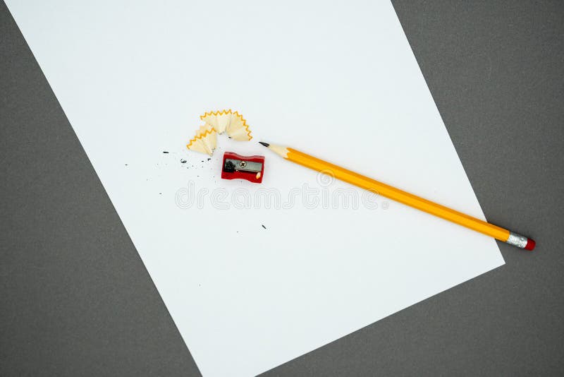 Pencil with Sharpener and Sharpening Shavings on White A4 Paper, on ...