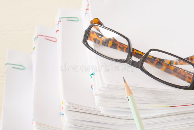 Pencil and Spectacles Put on Stack of Overload Paper Stock Image ...