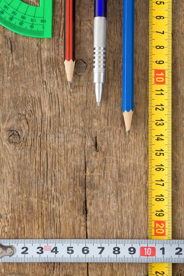Pencil and Tape Measure on Wood Stock Image - Image of grid, black ...