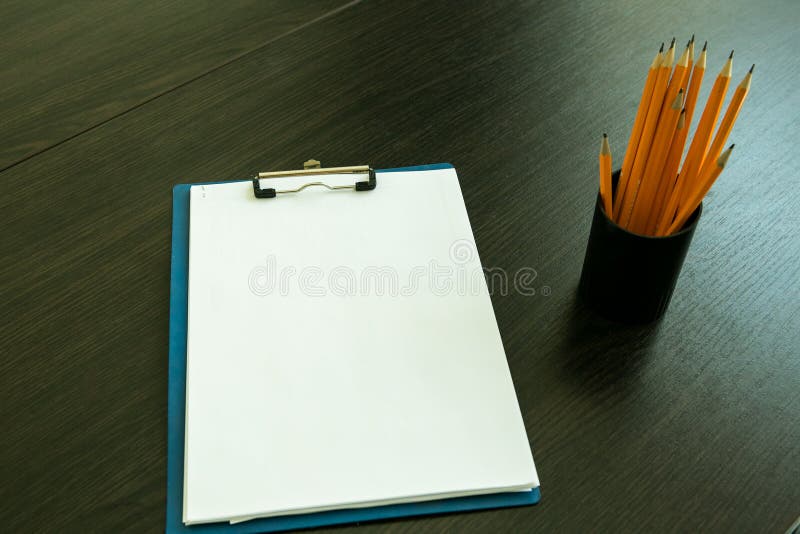 Pencils in a Black Plastic Pencil Case and a Blank White Notepad on a ...