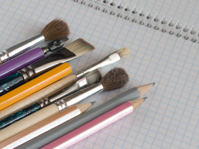 Pencils and Brushes on Copy-book Stock Image - Image of artistic ...