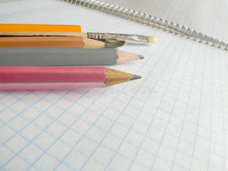 Pencils and Brushes on Copy-book Stock Photo - Image of draw, artistic ...