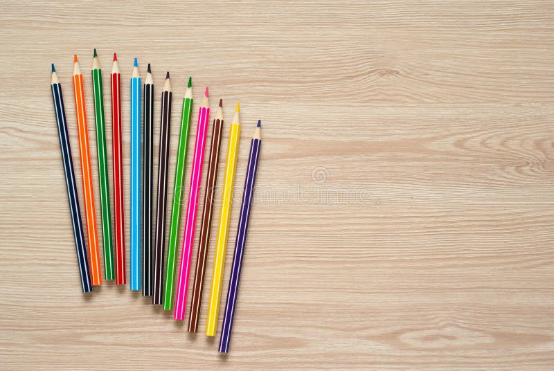 Pencils, Crayons and Notebook on a Desk. Stock Image - Image of ...