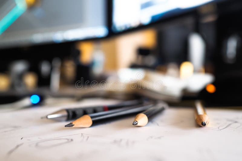 Pencils on a Desk, Near Computer Monitors and a Sketch Stock Photo ...