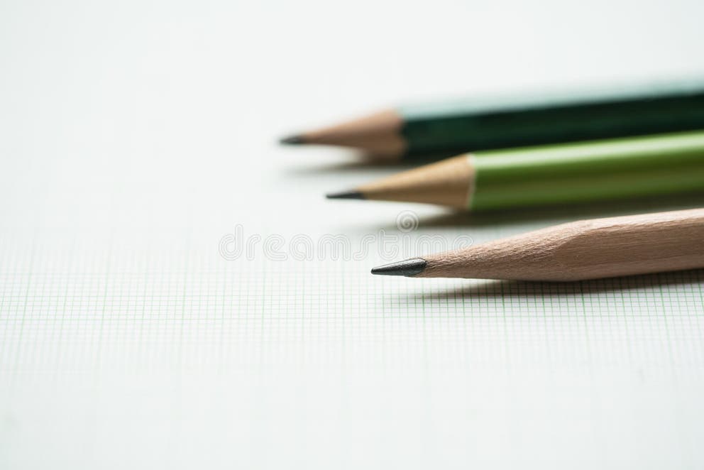 Pencils on graph paper stock image. Image of grid, freehand - 97652519