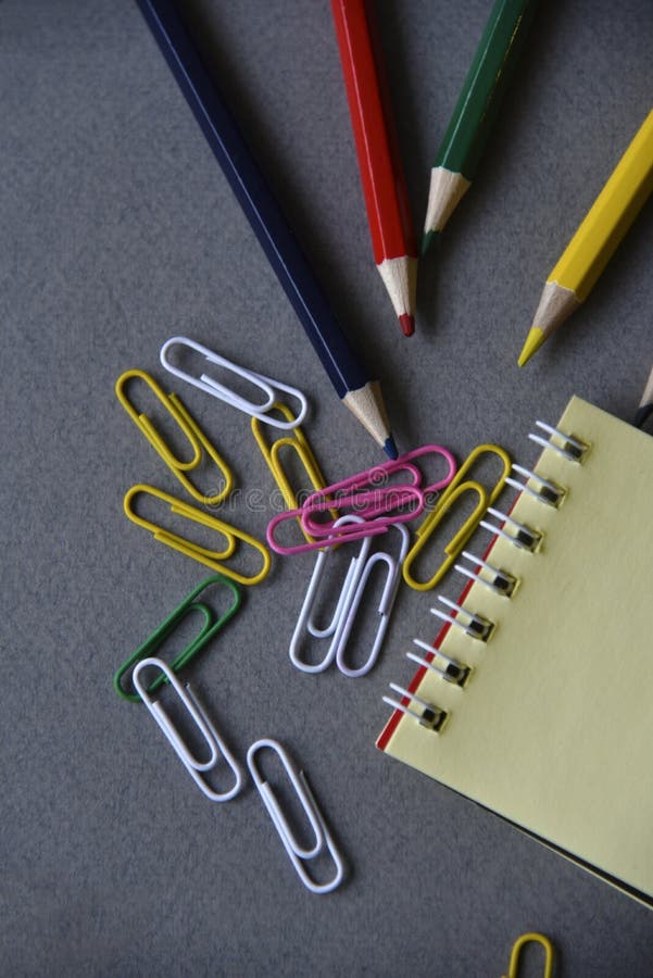 Pencils Notepad and Paper Clips on the Office Desk Stock Image - Image ...