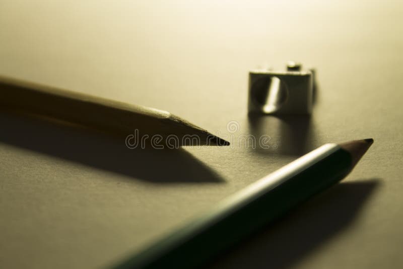Pencils and Pencil Sharpener on the Paper in the Backlight Stock Image ...