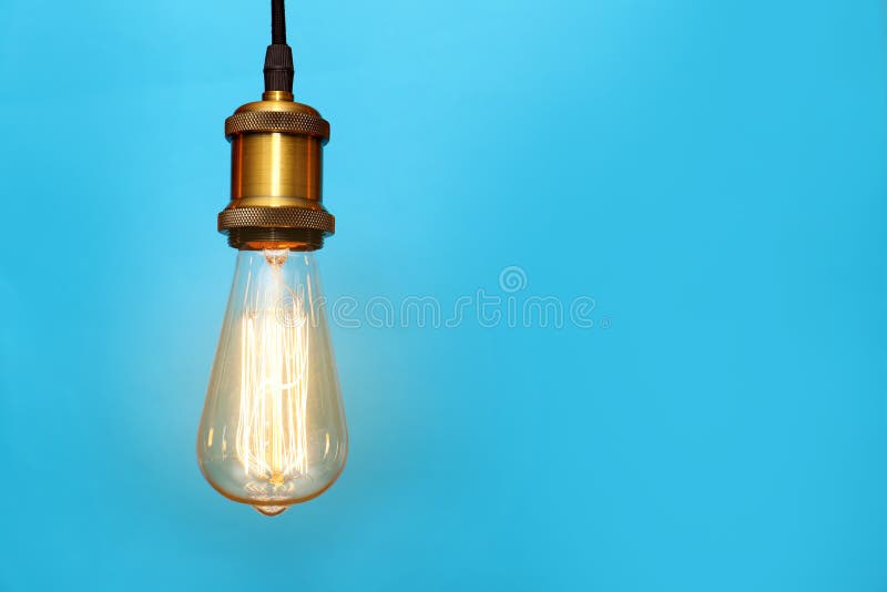 Pendant Lamp with Light Bulb on Color Background Stock Photo - Image of ...