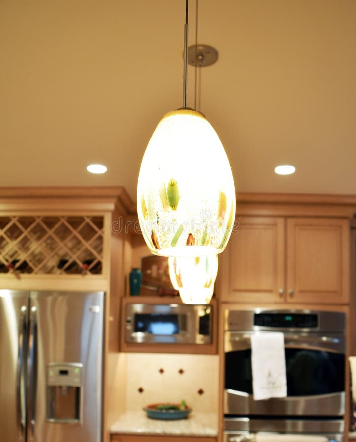 Pendant lights in kitchen stock photo. Image of beautiful - 76539282