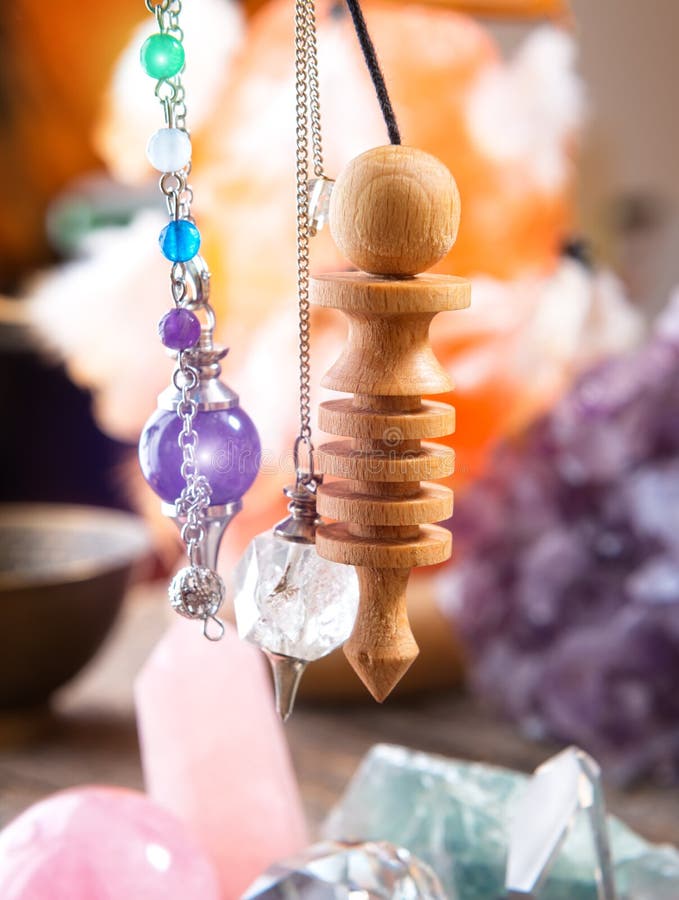 Pendulum and crystals stock image. Image of measurement - 69936187
