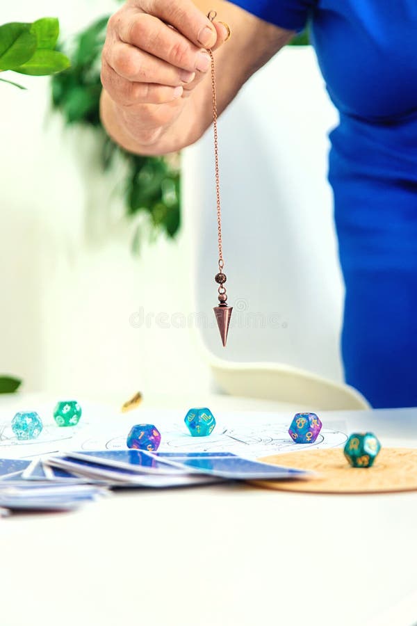Pendulum Fortune Telling and Astrology. Selective Focus Stock Photo ...