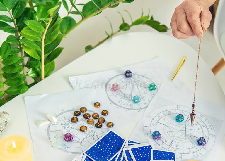 Pendulum Fortune Telling and Astrology. Selective Focus Stock Image ...