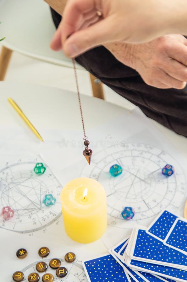 Pendulum Fortune Telling and Astrology. Selective Focus Stock Photo ...