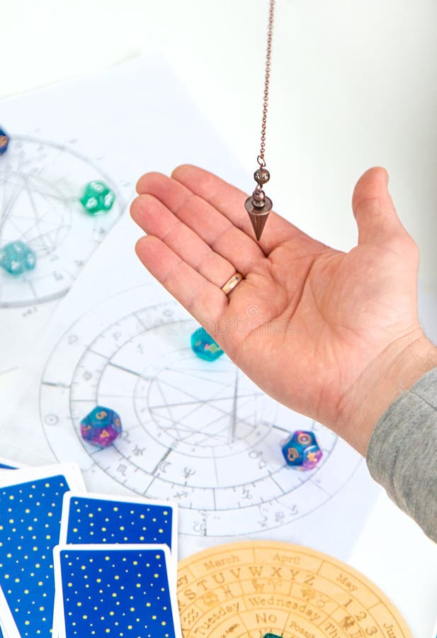 Pendulum Fortune Telling and Astrology. Selective Focus Stock Photo ...