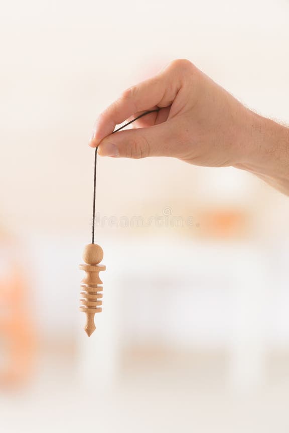 Pendulum stock image. Image of metal, dowse, male, dowsing - 41615865