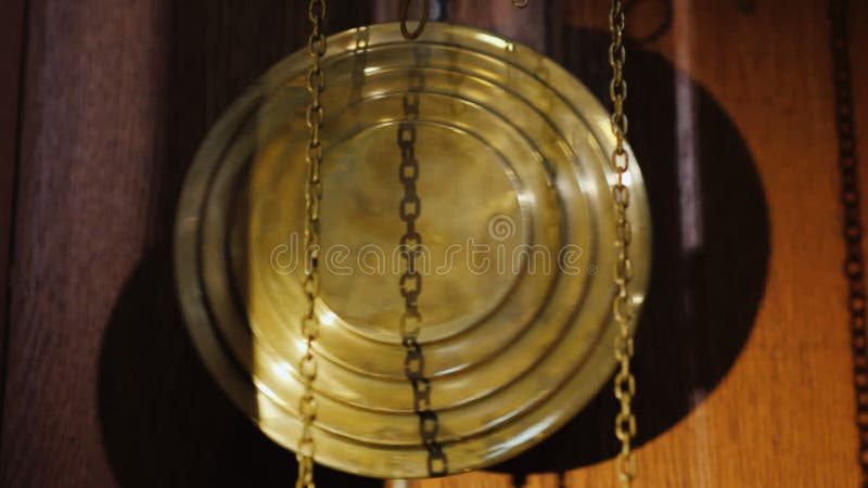 The Pendulum of the Old Antique Clock, Swinging from Side To Side. Old ...