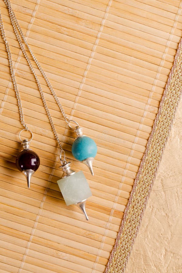 Pendulums To Balance the Chakras Stock Image - Image of healer ...