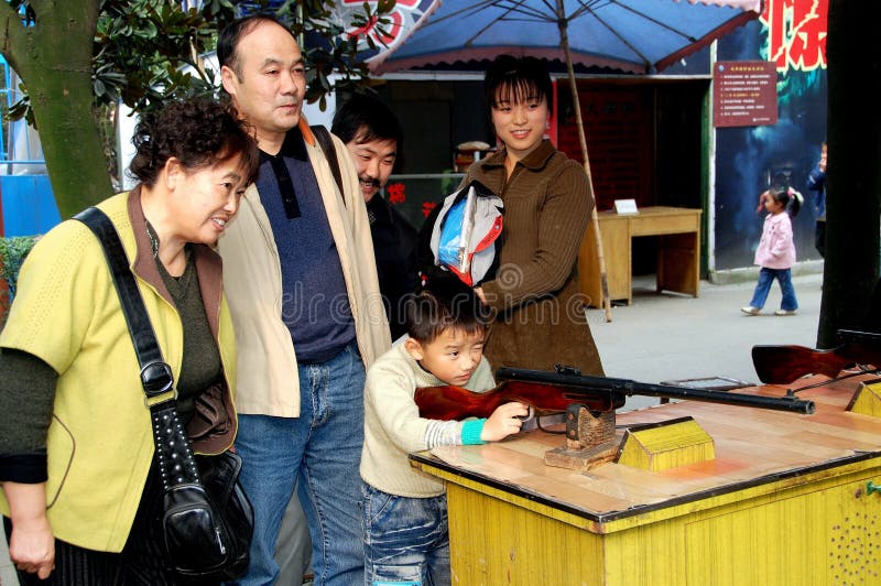 Pengzhou, China: Little Boy with Toy Gun Editorial Stock Image - Image ...