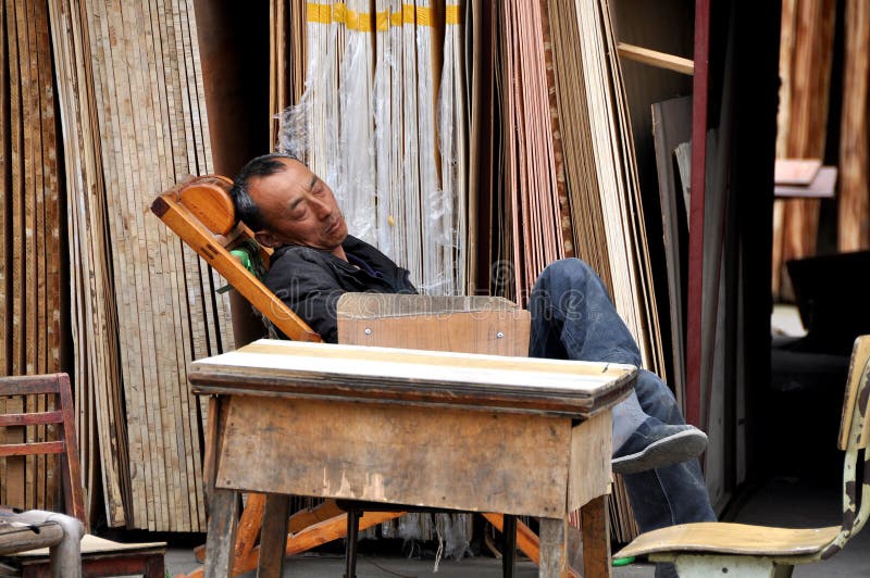 Pengzhou, China: Sleeping Lumber Merchant Editorial Photo - Image of ...