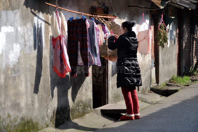 Pengzhou, China: Woman Hanging Laundry Editorial Image - Image of home ...