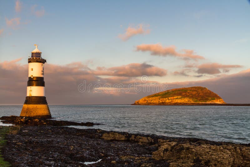 Penmon, Pen Mon Lighthouse at Sunset Stock Photo - Image of beacon ...