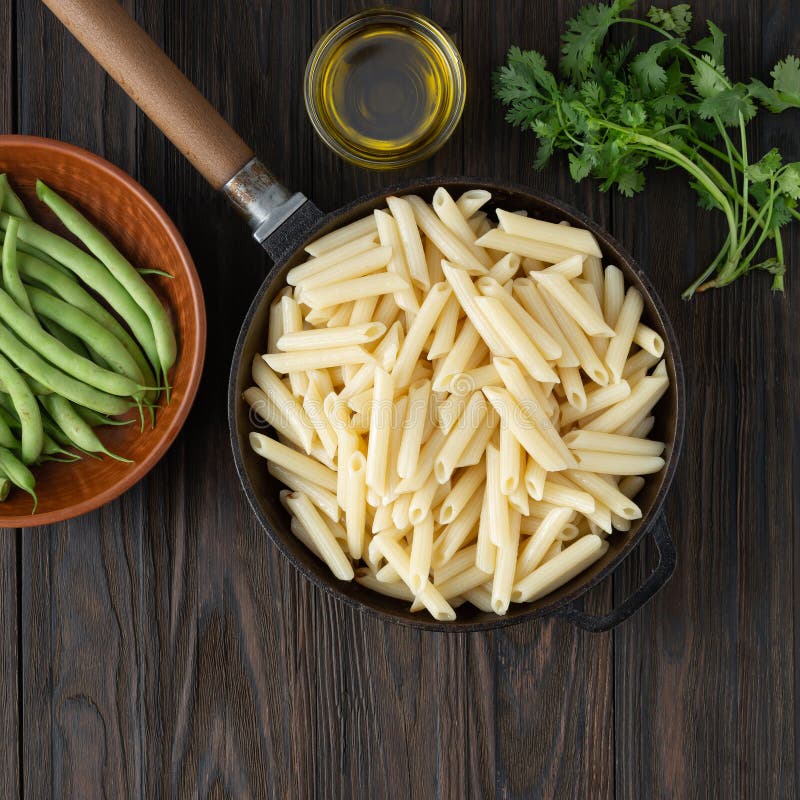 Penne Italian Pasta in a Frying Pan, Rustic Style. Top View Stock Photo ...